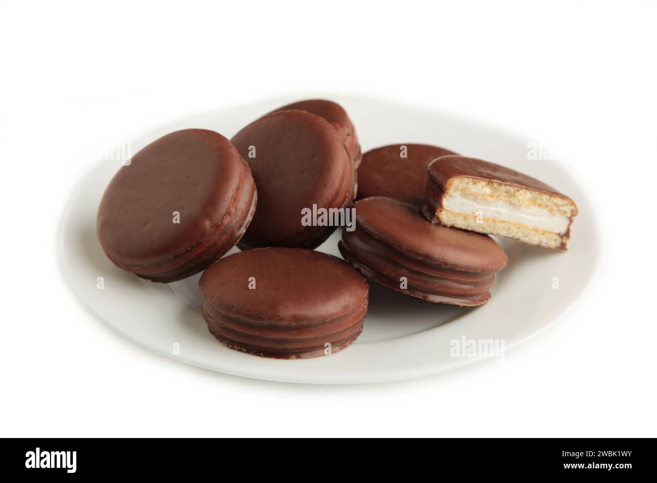 Choco pie chocolate coated snacks in plate isolated on white background ...