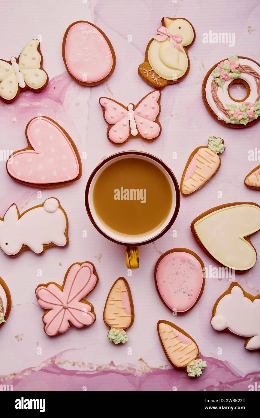 Easter background - coffee cup among pastel cookies. Spring card with ...