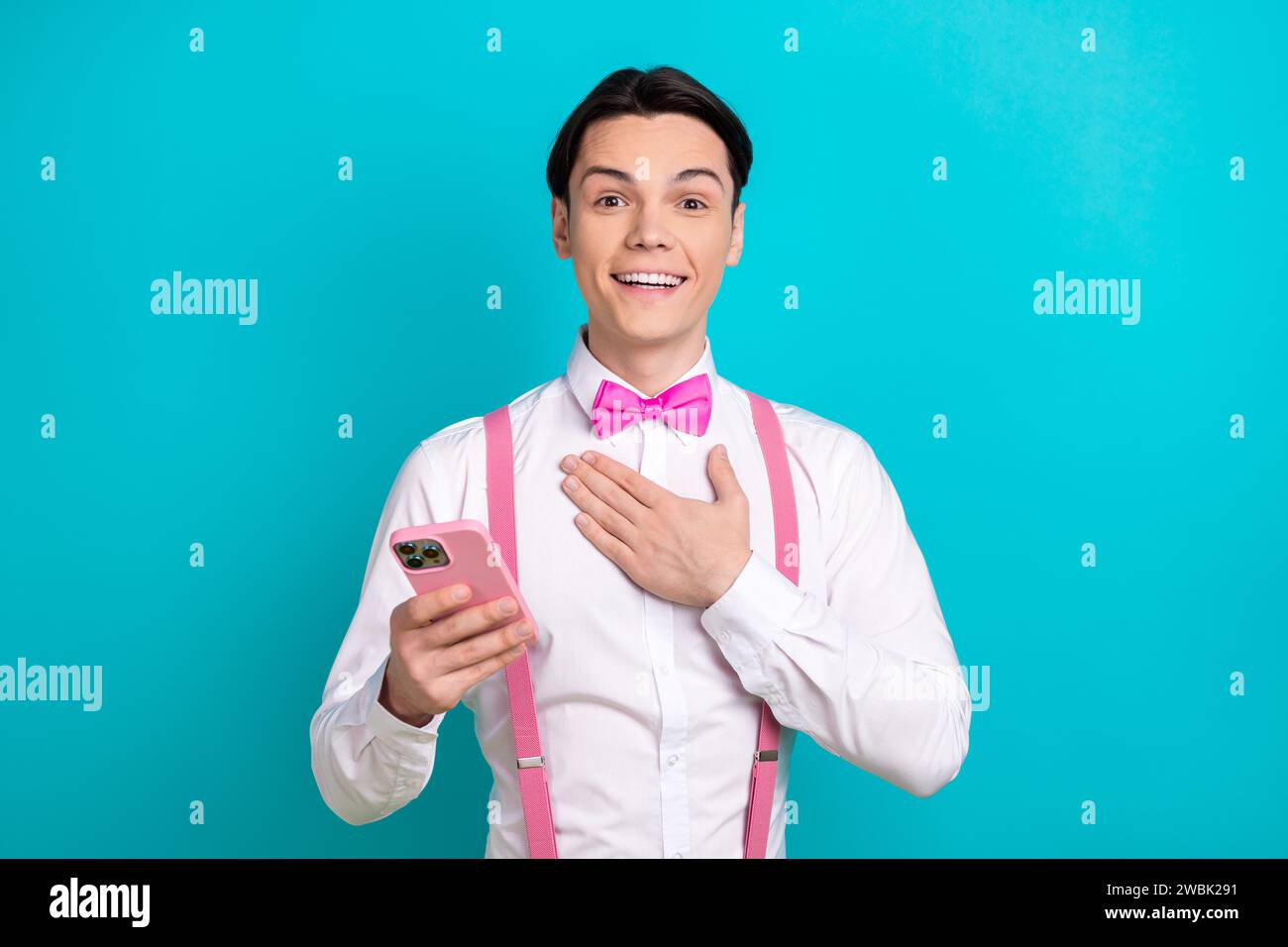 Photo portrait of attractive young man touch chest impressed device ...