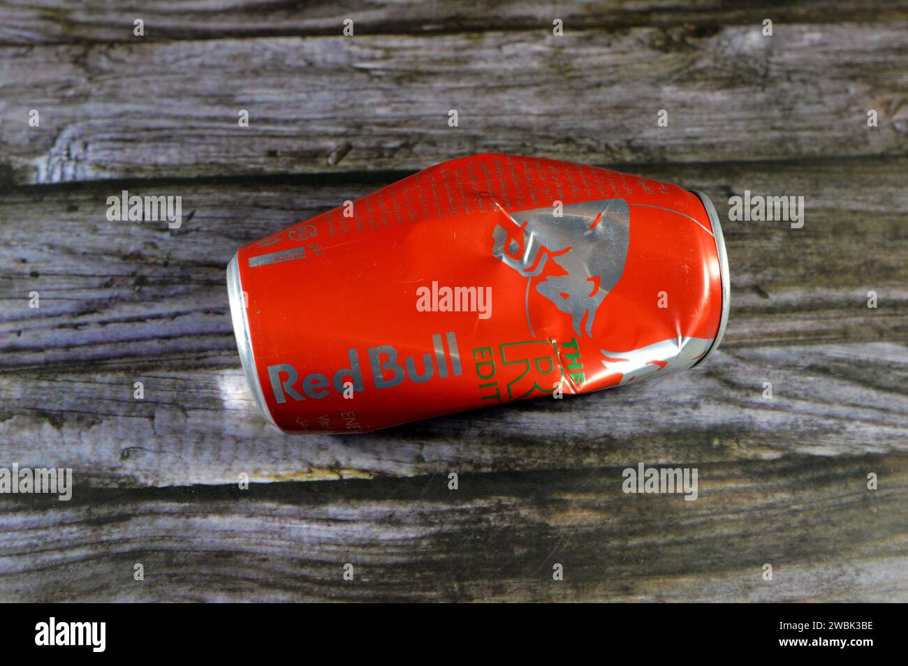 Cairo, Egypt, January 9 2024: Crushed dented Red Bull energy drink, a ...