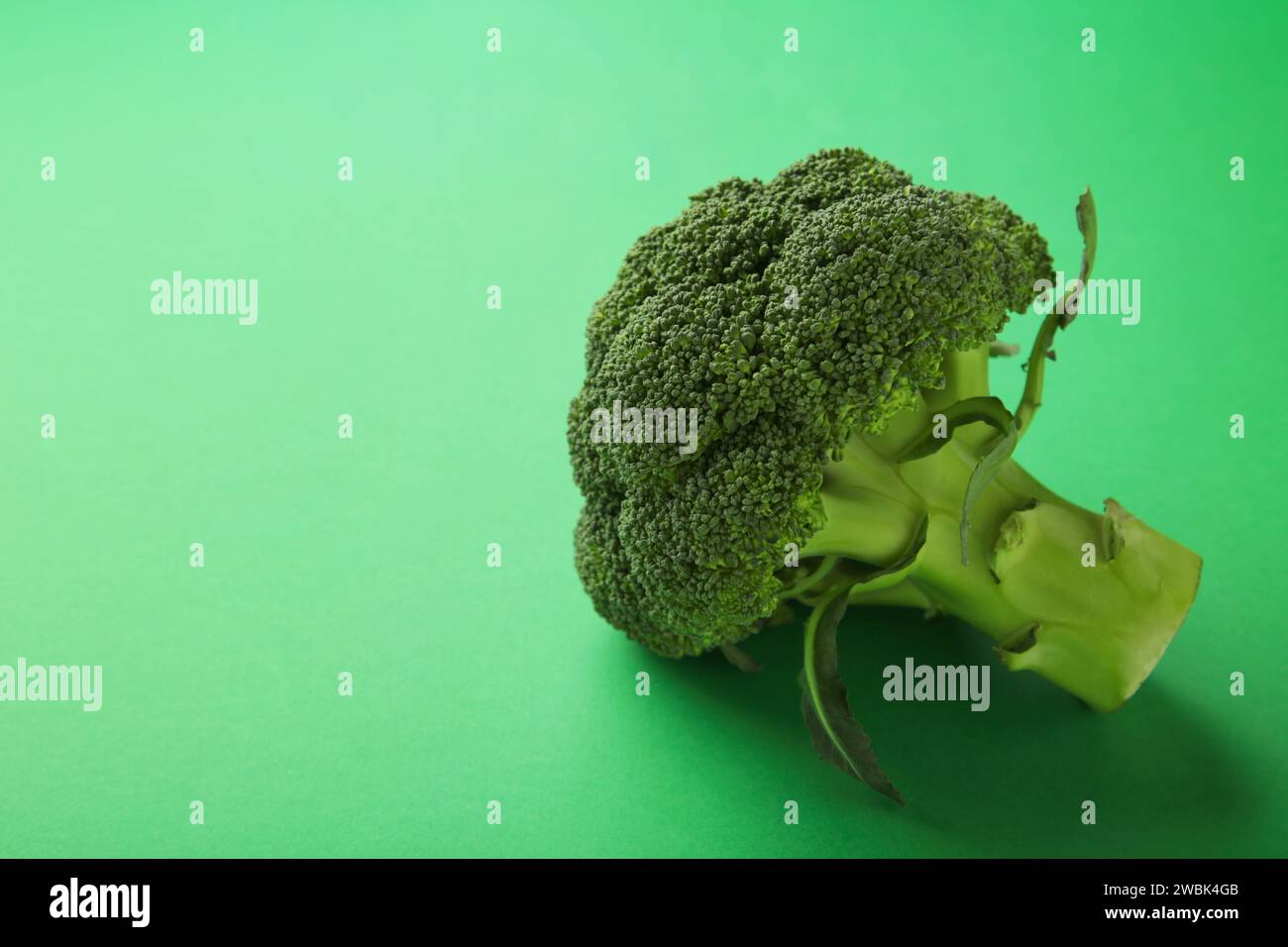 Broccoli cabbage on a green background. Pattern of fresh broccoli ...