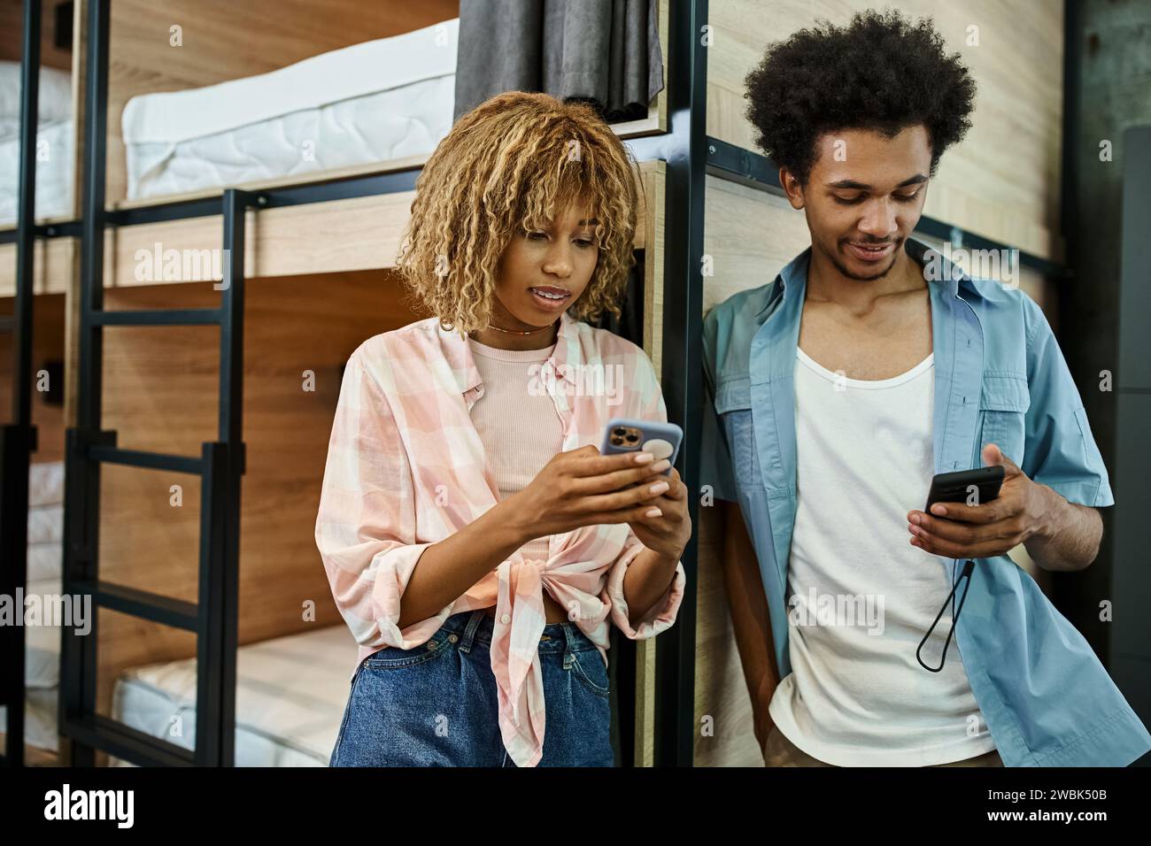 Stylish african friends using smartphones hi-res stock photography and ...