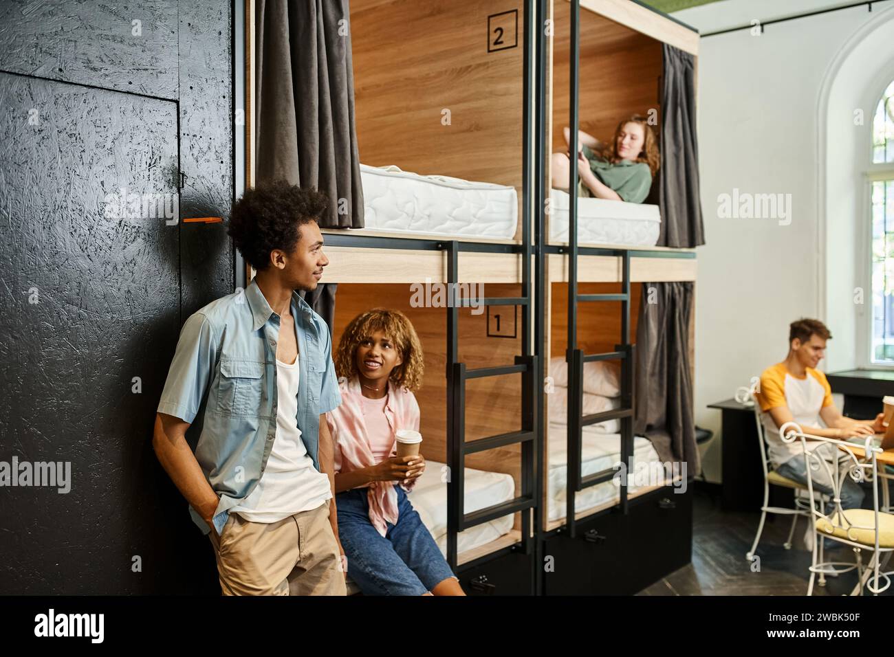 Roommates talking in a hostel room hi-res stock photography and images ...