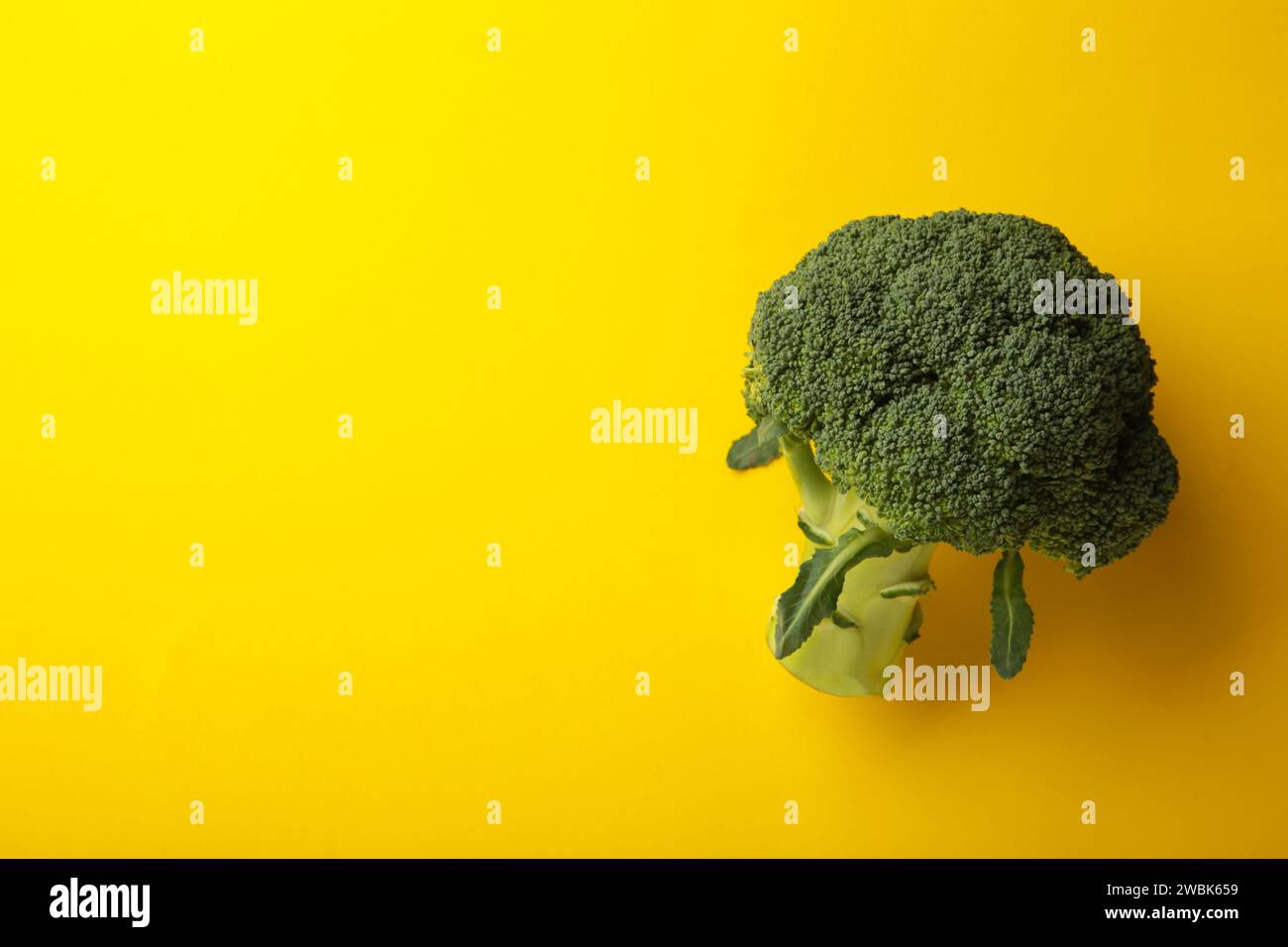 Broccoli cabbage on a yellow background. Pattern of fresh broccoli ...