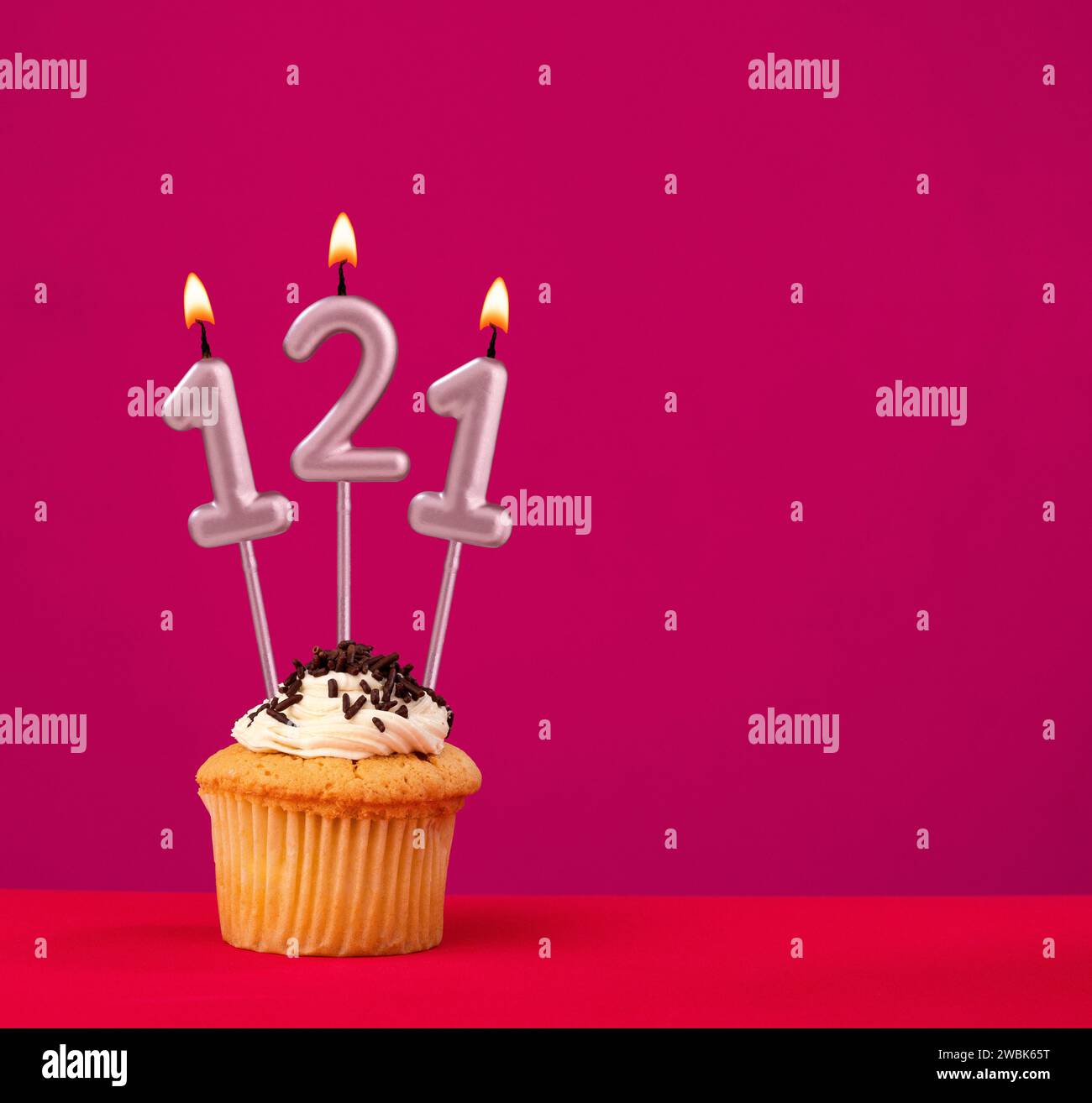 Birthday cake with candle number 121 - Rhodamine Red foamy background ...
