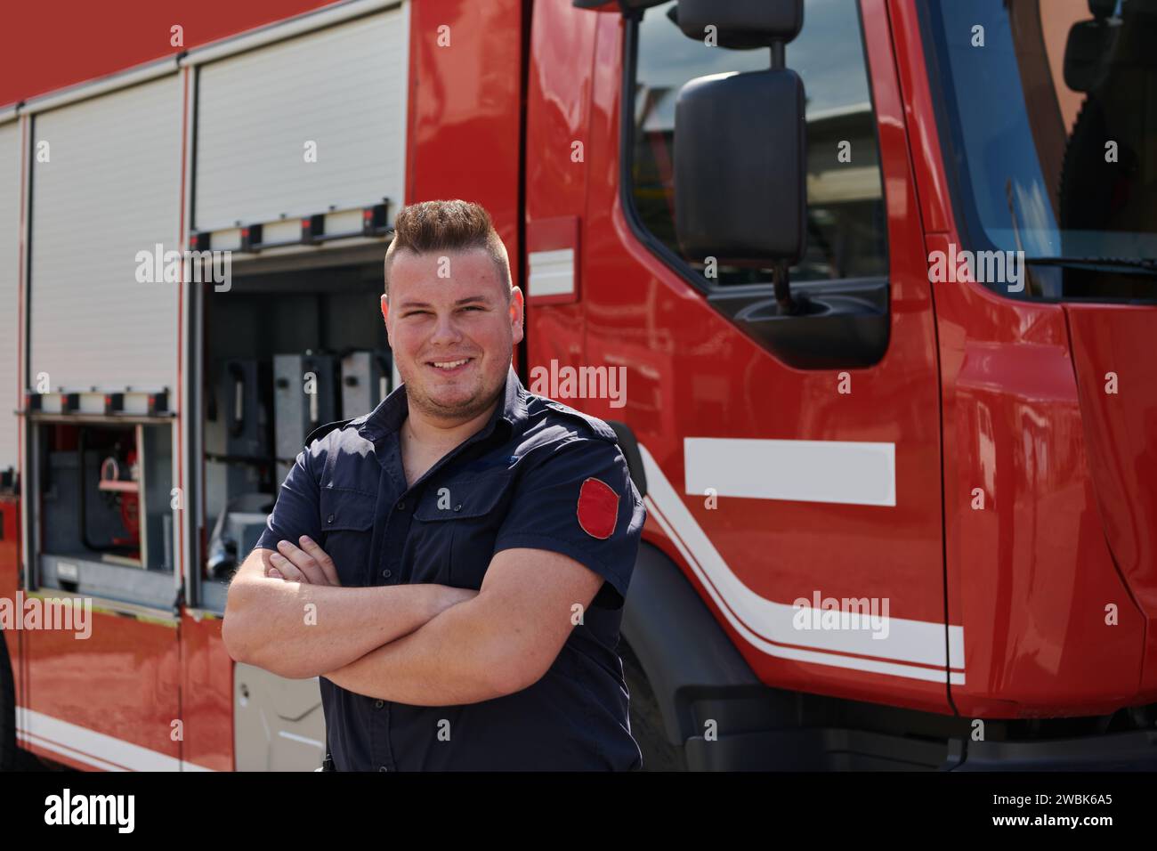 Confident firefighter stands with crossed arms, exuding resilience and ...