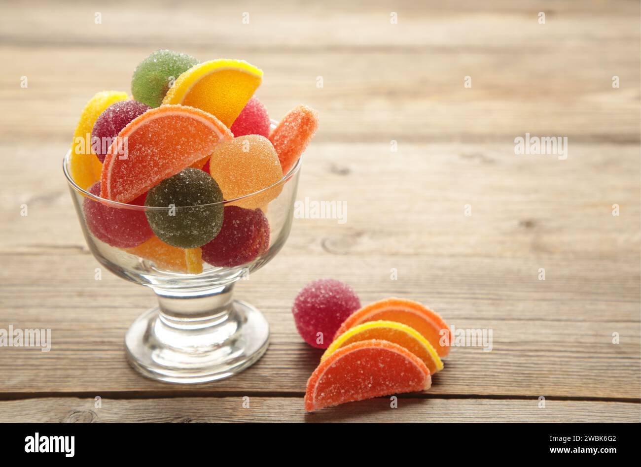 Jelly sugar candies in glass bowl on grey background. Top view Stock ...