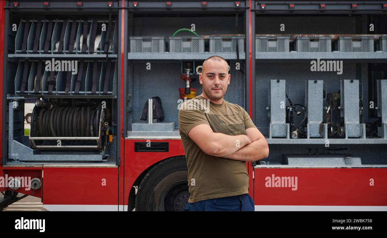 Confident firefighter stands with crossed arms, exuding resilience and ...