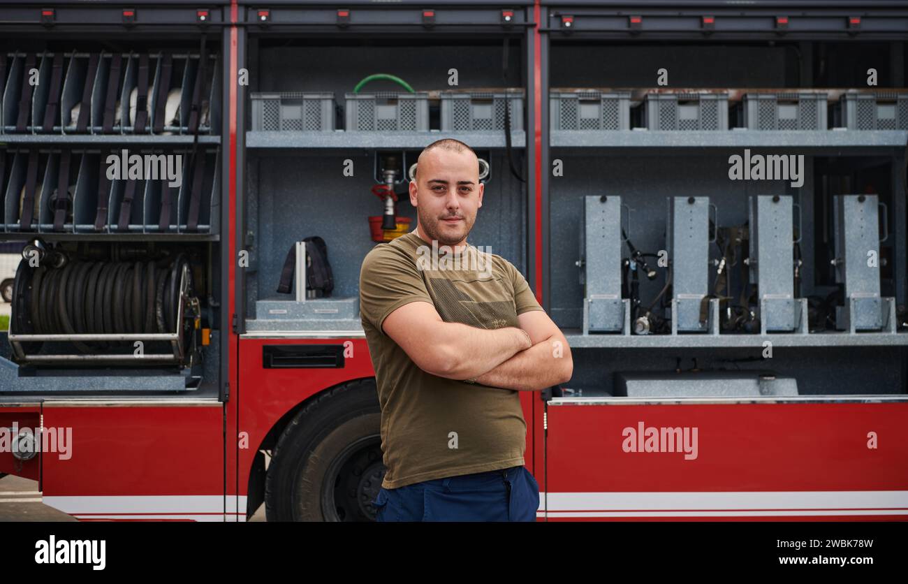 Confident firefighter stands with crossed arms, exuding resilience and ...