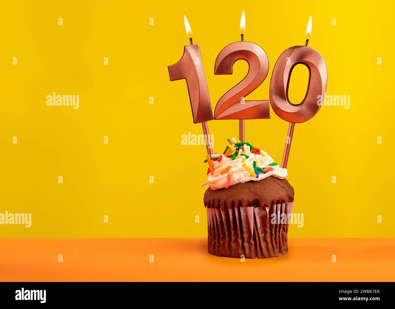 Number 120 birthday candle - Celebration on yellow background Stock ...