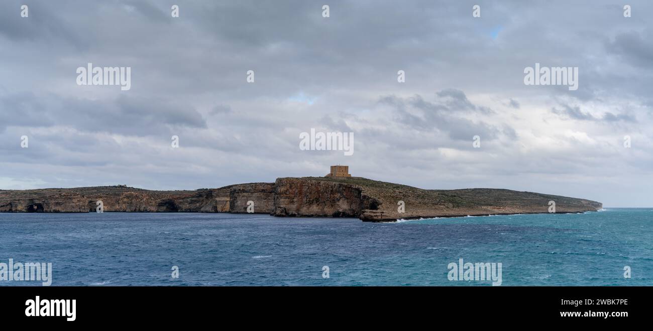 A panorama view of Comino Island and watchtower in the Gozo Channel in ...