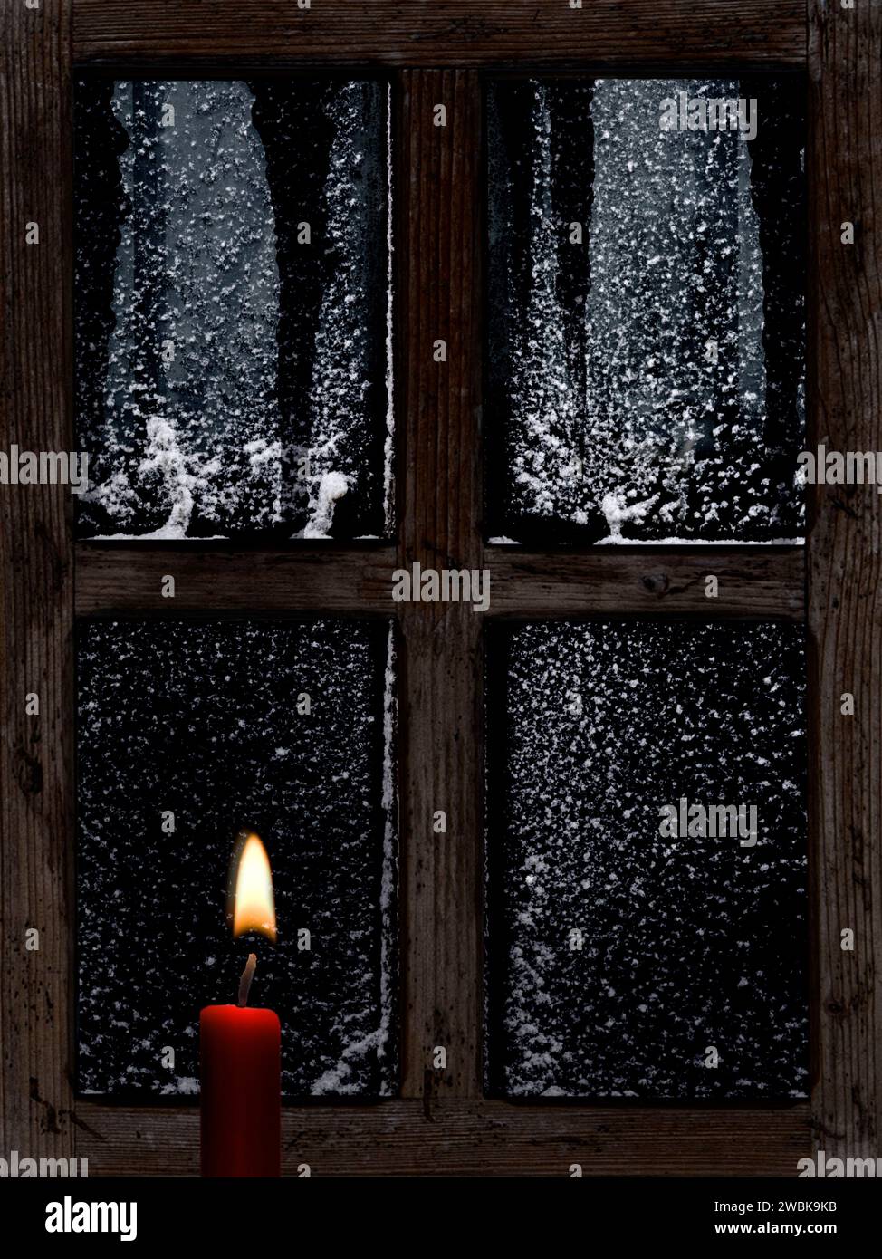 View through an old wooden window with a candle in winter Stock Photo ...