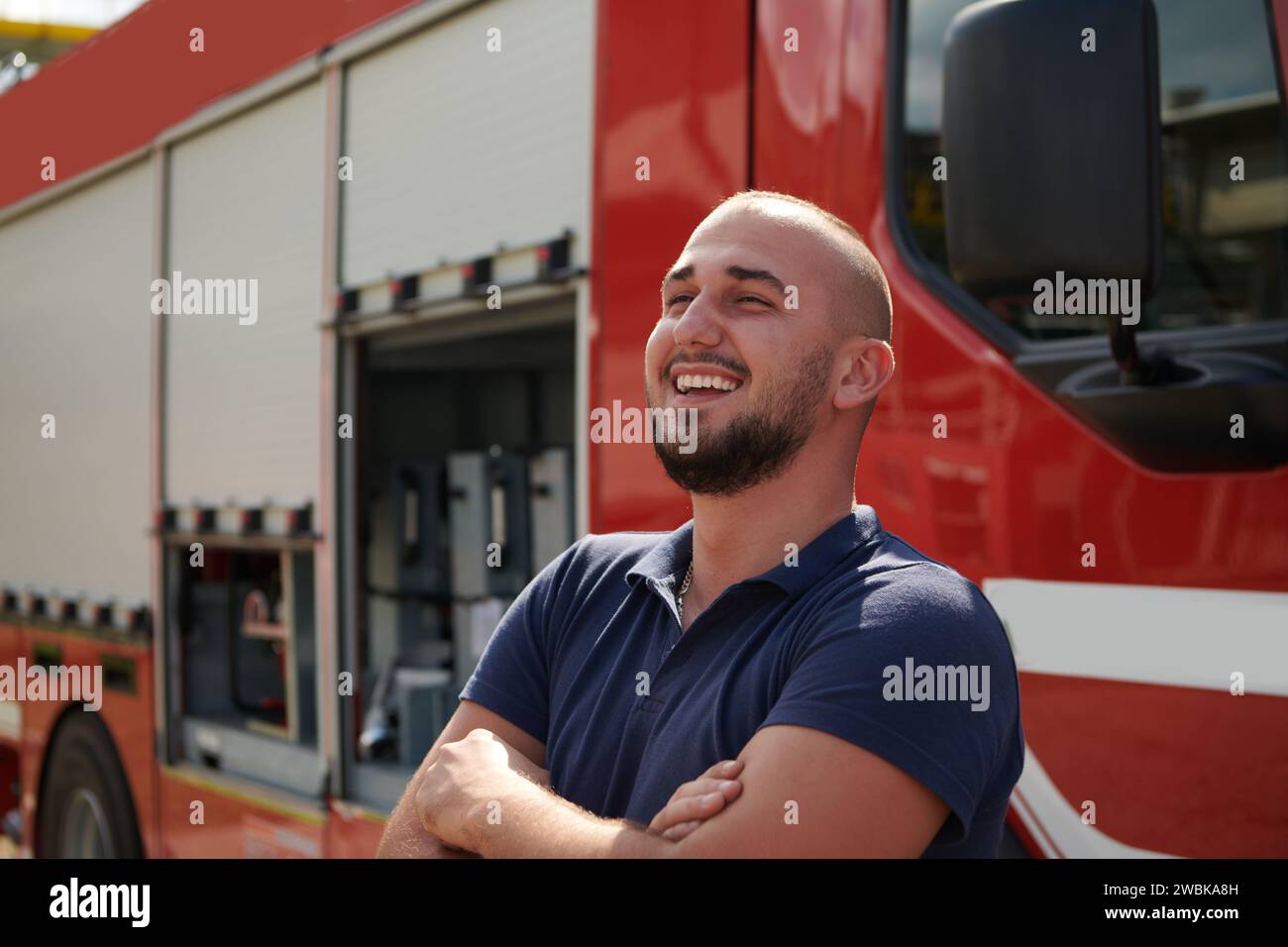 Confident firefighter stands with crossed arms, exuding resilience and ...