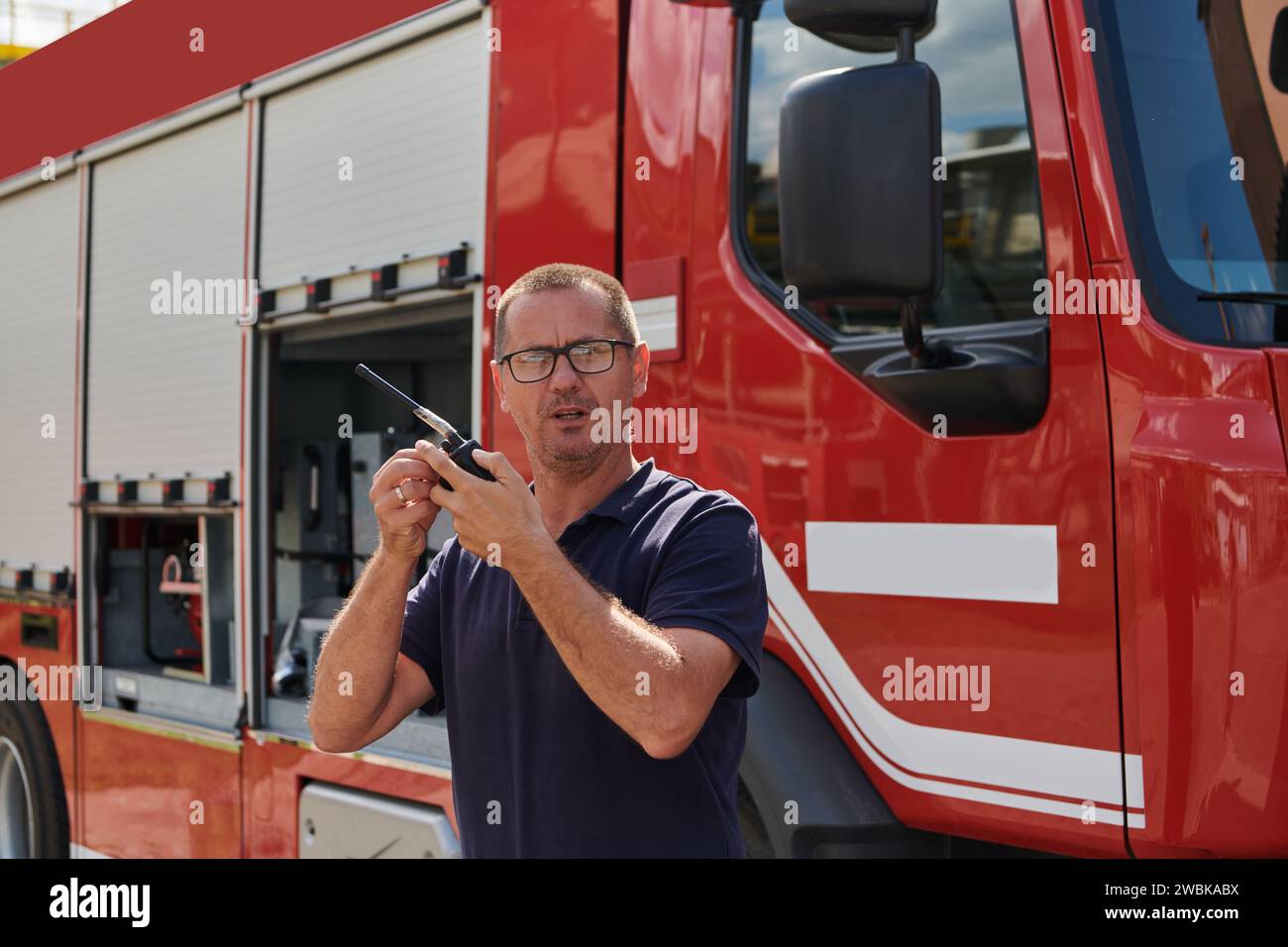 A dedicated firefighter, captured in a moment of communication, stands ...