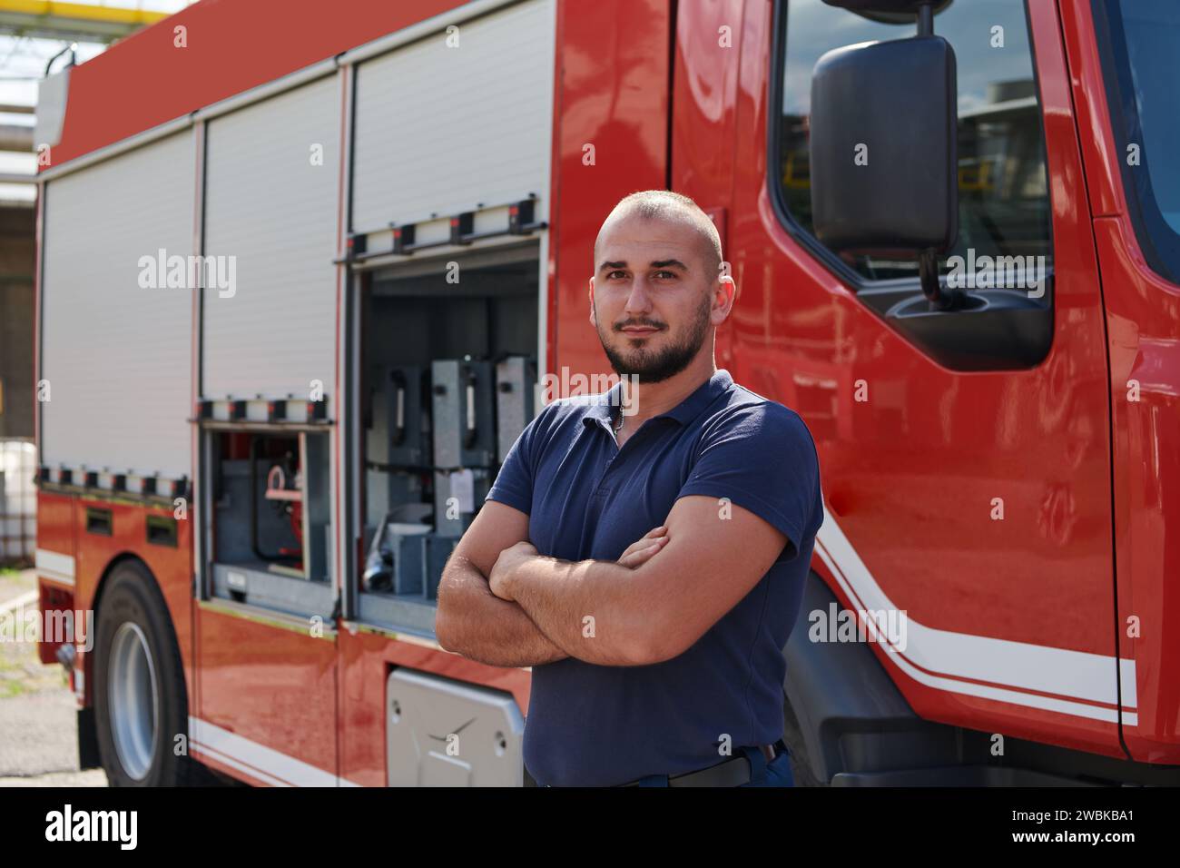 Confident firefighter stands with crossed arms, exuding resilience and ...