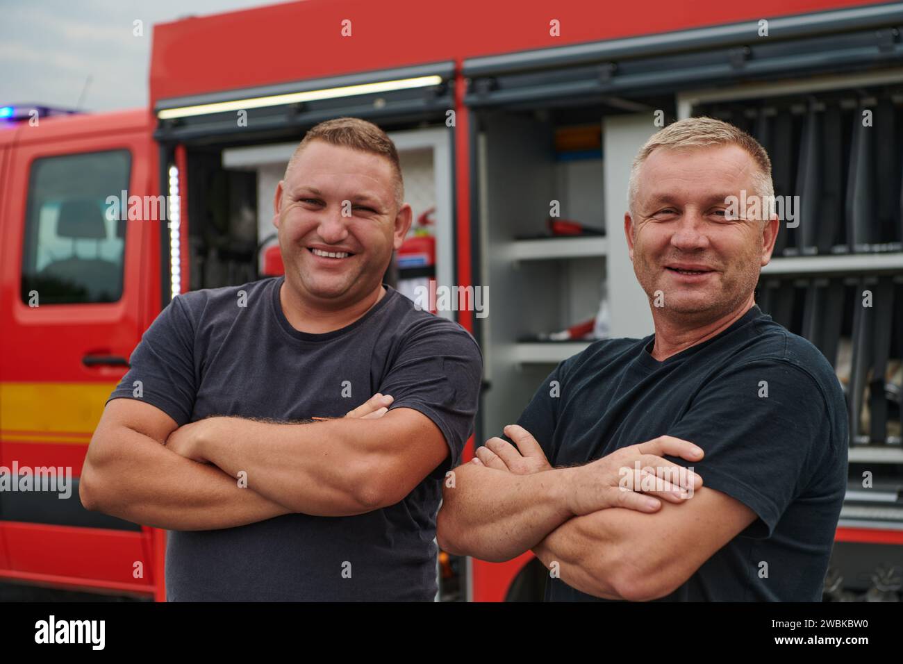 A skilled and dedicated professional firefighting team proudly poses in ...