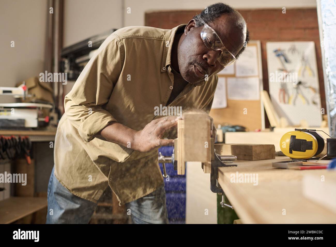 African american male carpenter blowing hi-res stock photography and ...