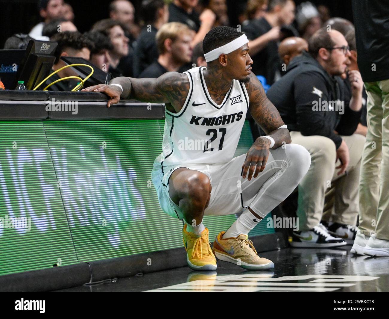January 10, 2024: UCF Knights forward C.J. Walker (21) at the scoring table waits to re-enter ...