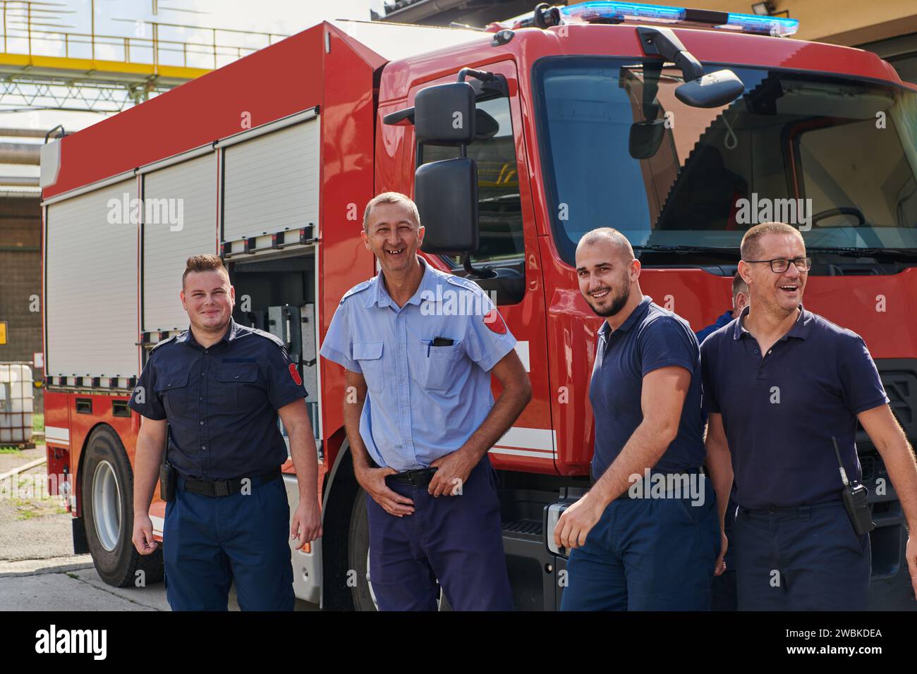 A skilled and dedicated professional firefighting team proudly poses in ...