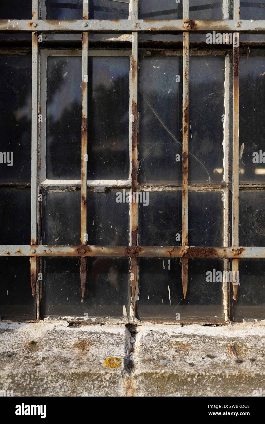 Rusted metal grille in front of an old sash bar window Stock Photo - Alamy