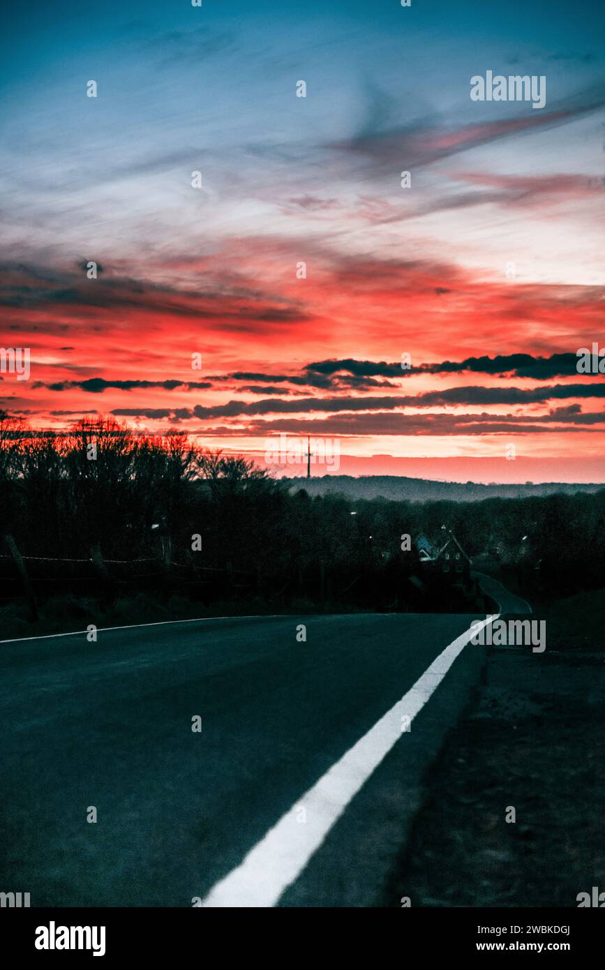 Lonely road at dusk hi-res stock photography and images - Alamy
