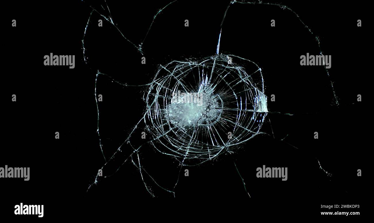 Golf Ball breaking Pane of Glass against Black Background Stock Photo ...