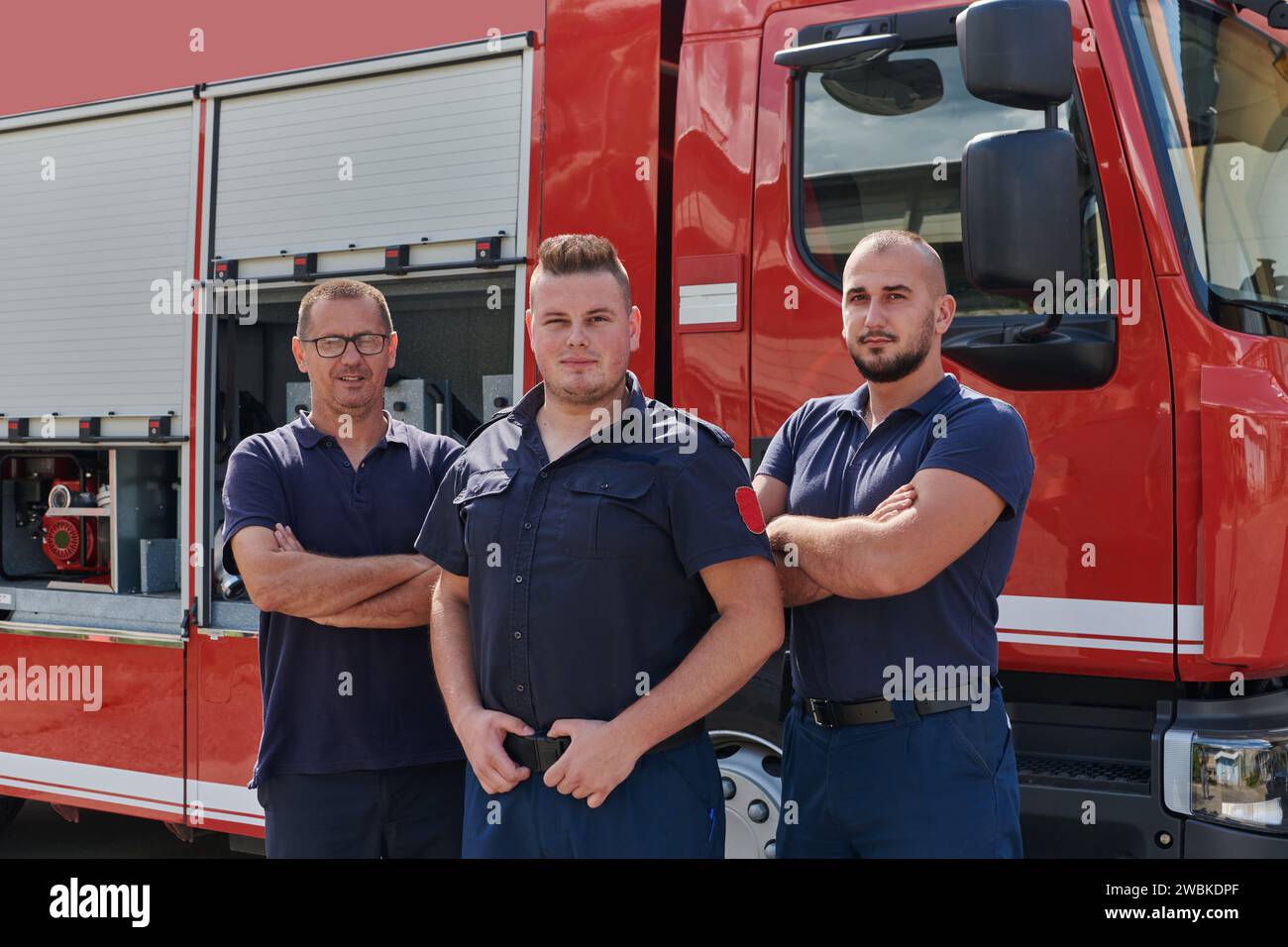 A skilled and dedicated professional firefighting team proudly poses in ...