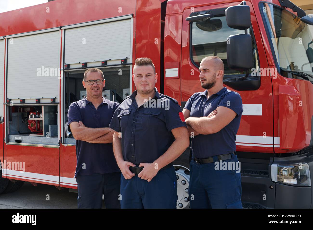 A skilled and dedicated professional firefighting team proudly poses in ...