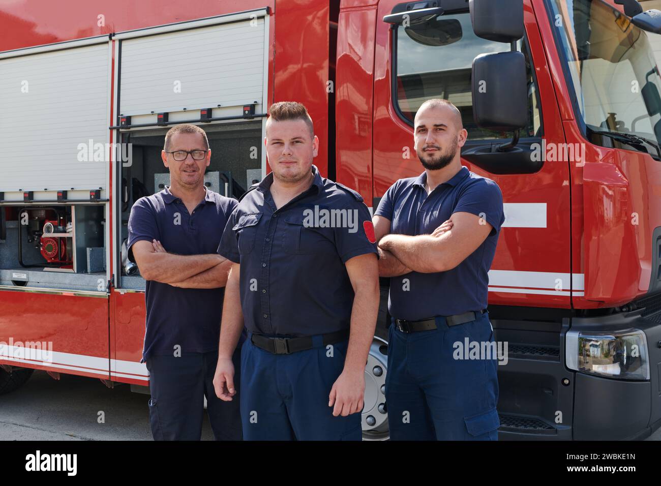 A skilled and dedicated professional firefighting team proudly poses in ...