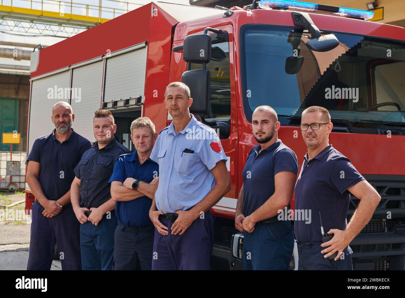 A skilled and dedicated professional firefighting team proudly poses in ...
