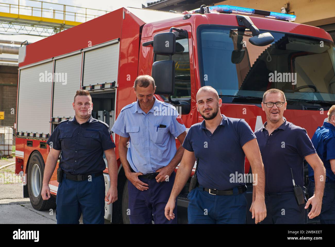 A skilled and dedicated professional firefighting team proudly poses in ...