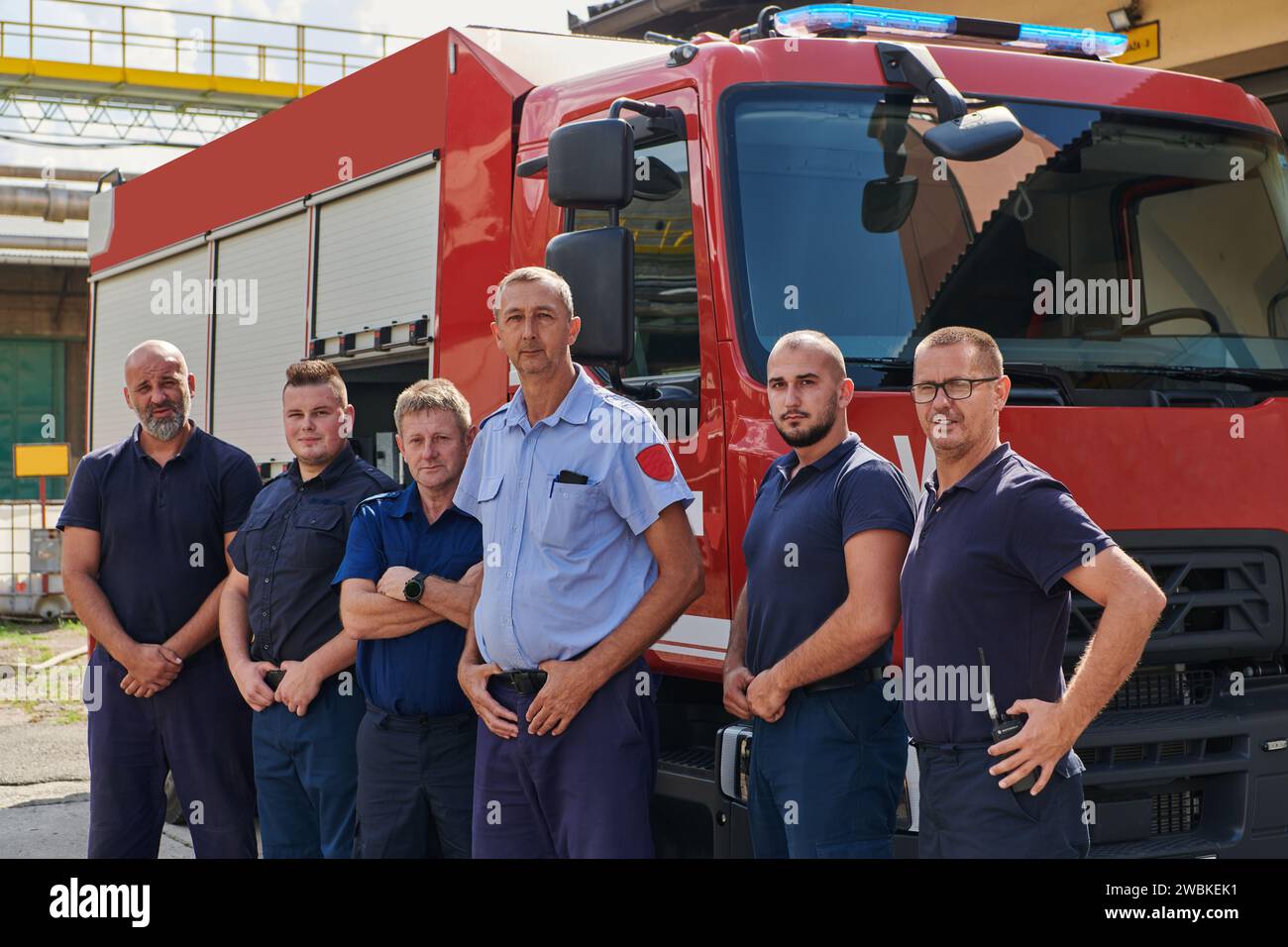 A skilled and dedicated professional firefighting team proudly poses in ...