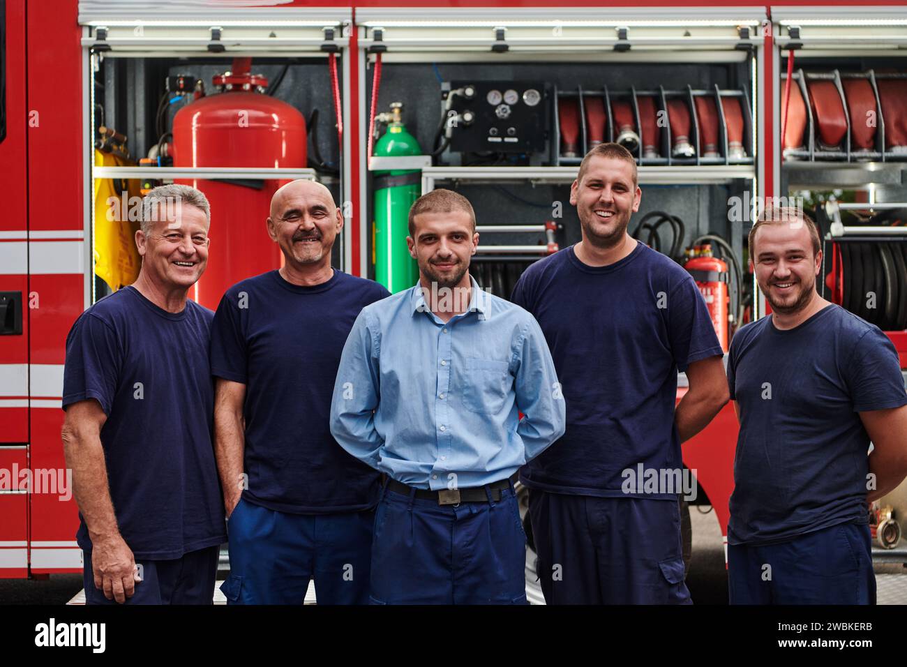 A skilled and dedicated professional firefighting team proudly poses in ...