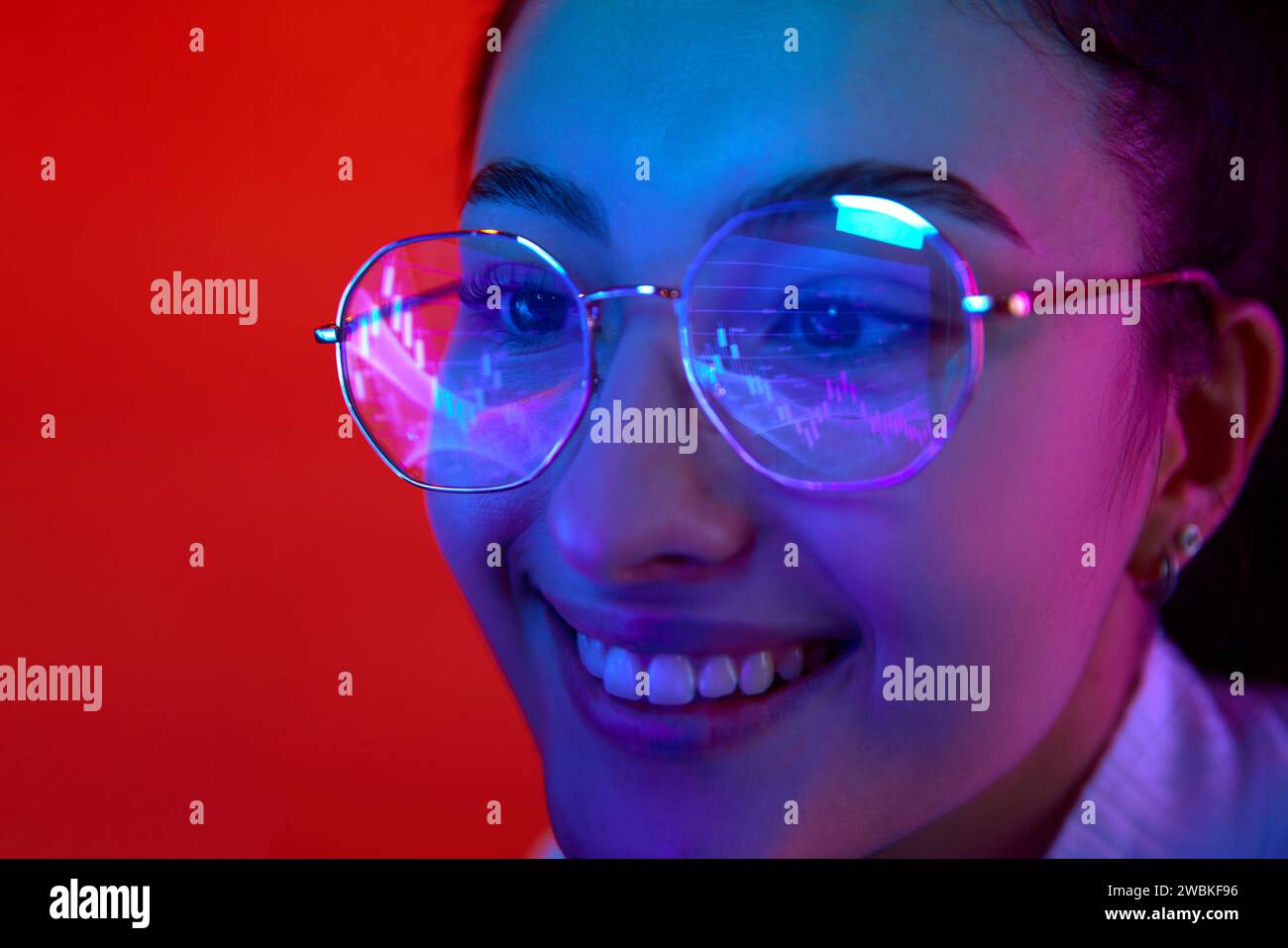 Smiling, happy developer, woman wears glasses working on computer ...