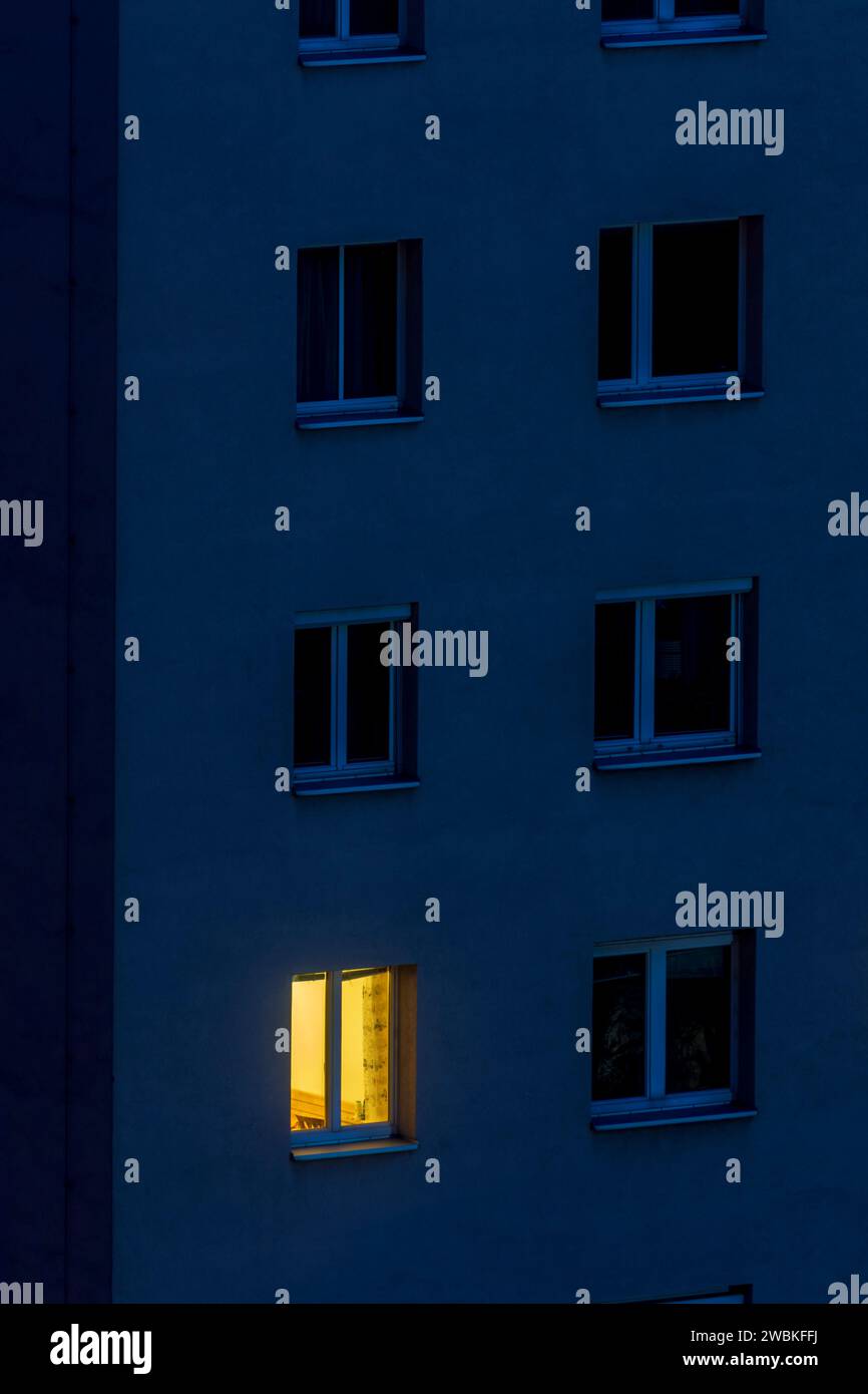 Vienna, lit single window in apartment house at night in 22. district ...