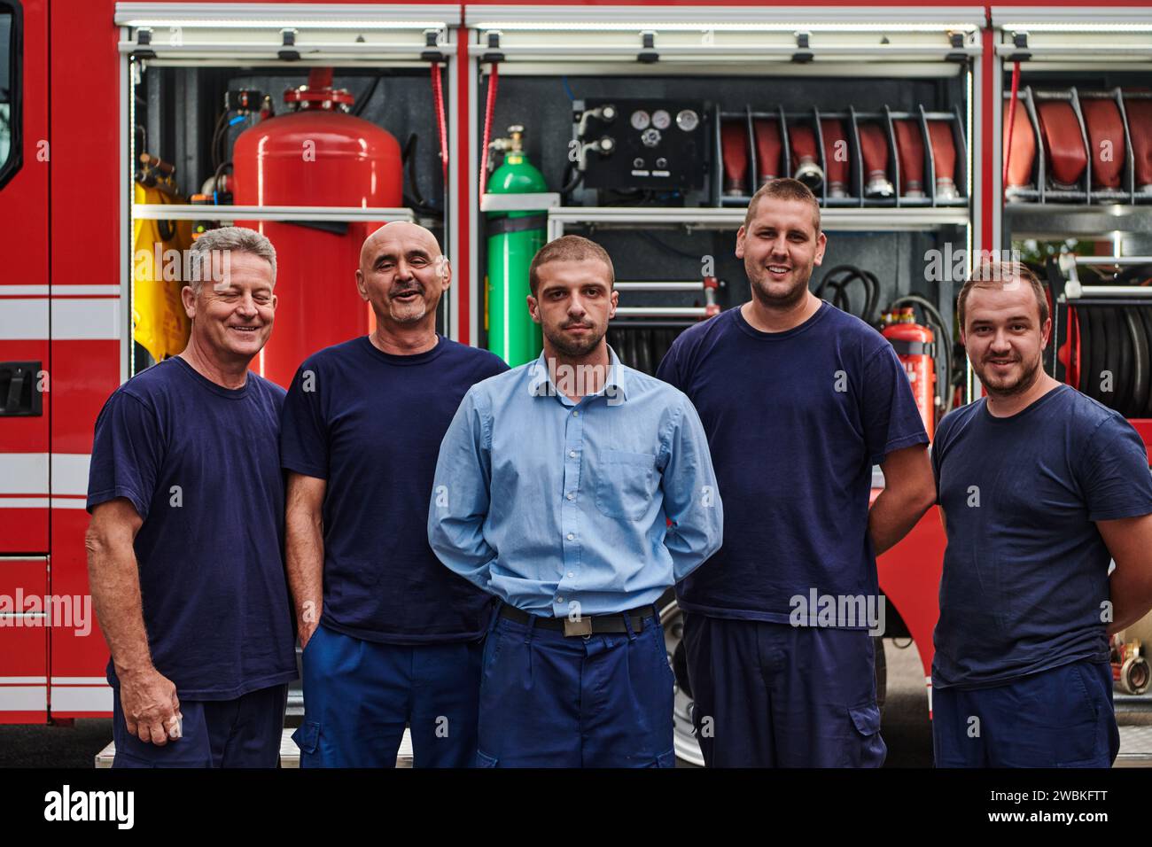 A skilled and dedicated professional firefighting team proudly poses in ...