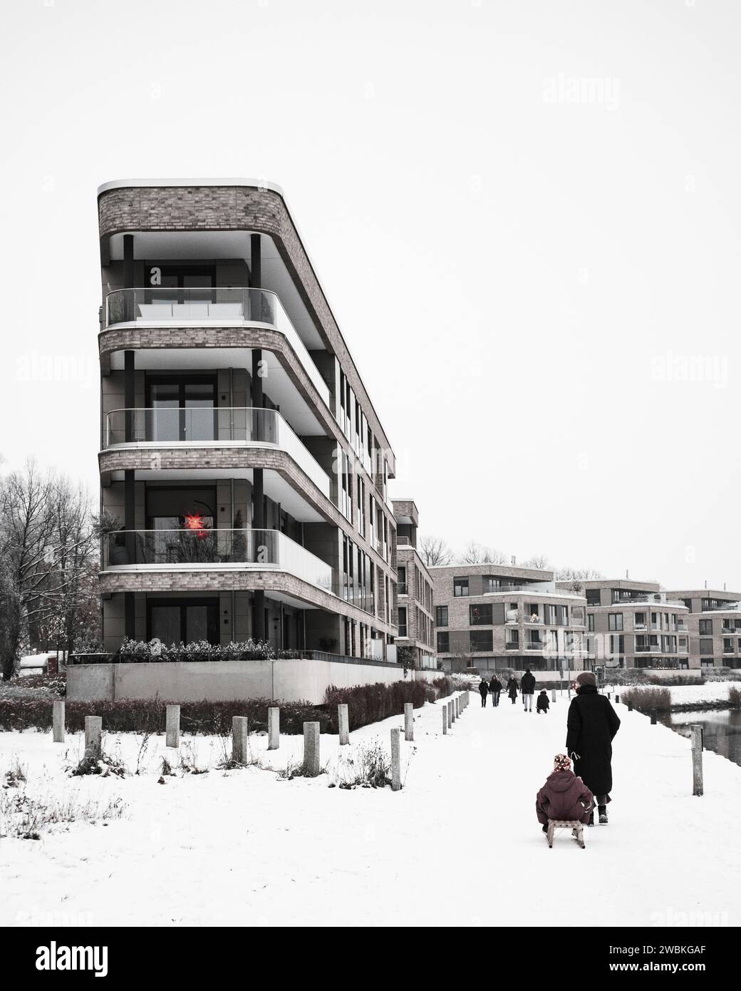 Snow walk with sledges and modern architecture hi-res stock photography ...