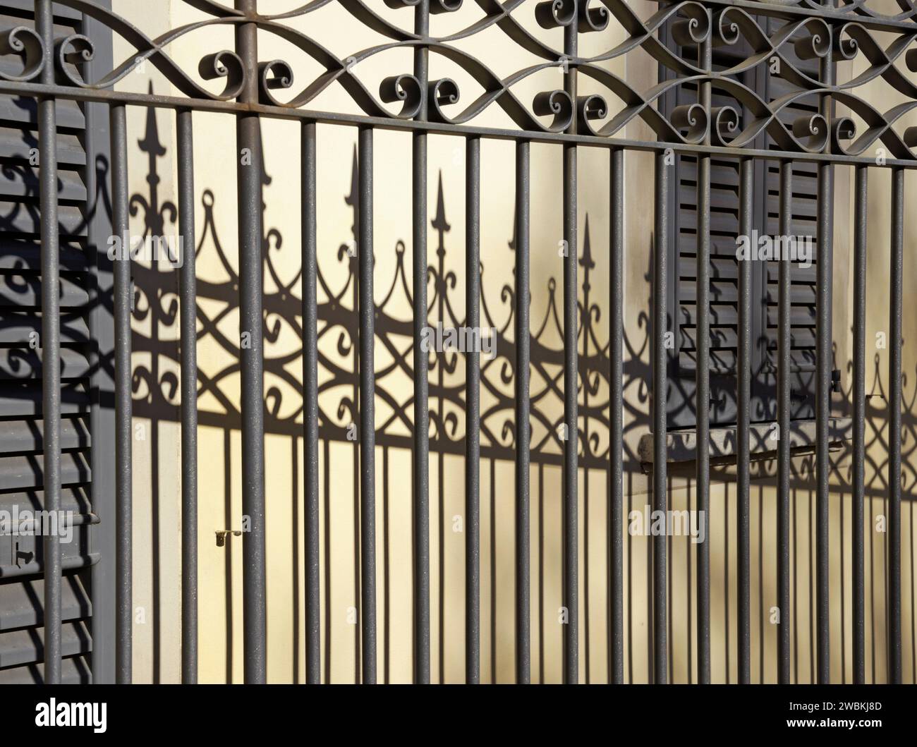 spiked wrought iron fence and gate ouside a residential building Stock ...
