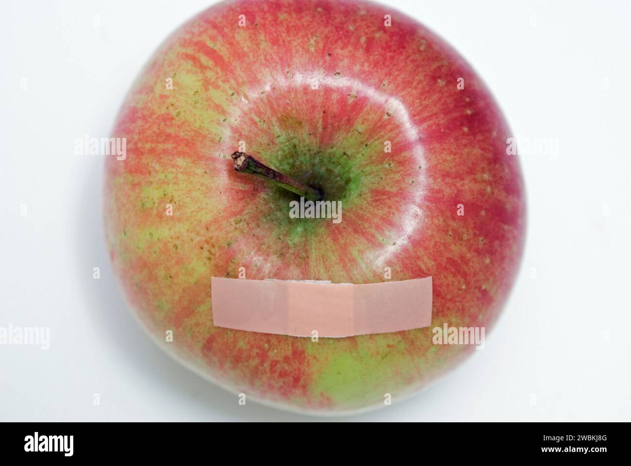Apple with band aid hi-res stock photography and images - Alamy