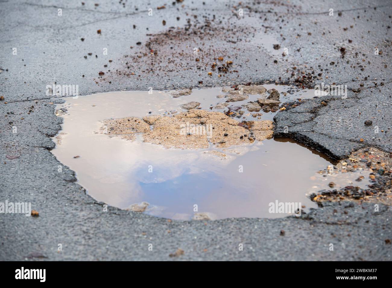 Wraysbury, UK. 11th January, 2024. A big pothole where floodwater has ...