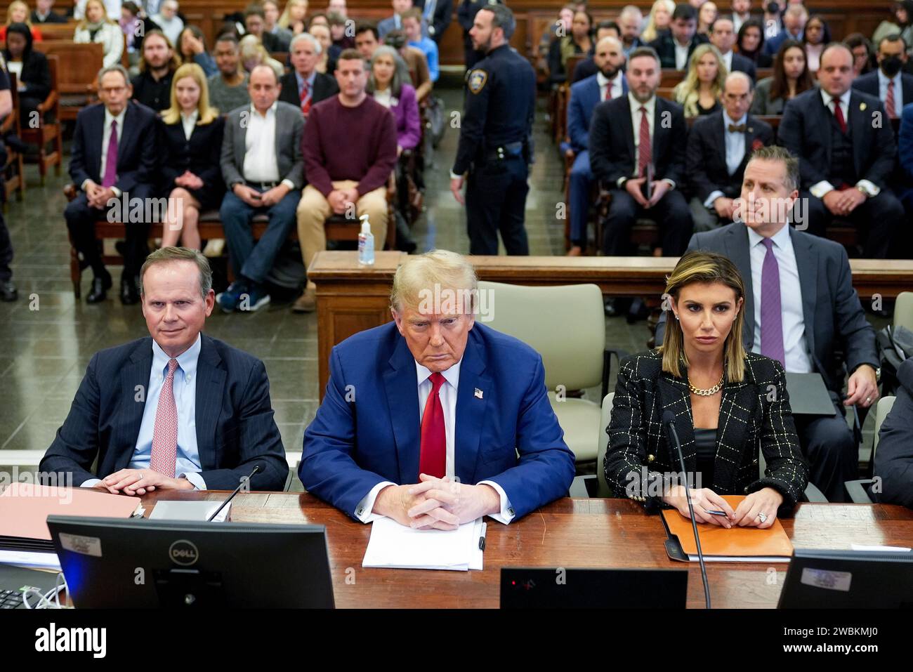 Flanked by his defense attorneys, Chris Kise, left, and Alina Habba ...