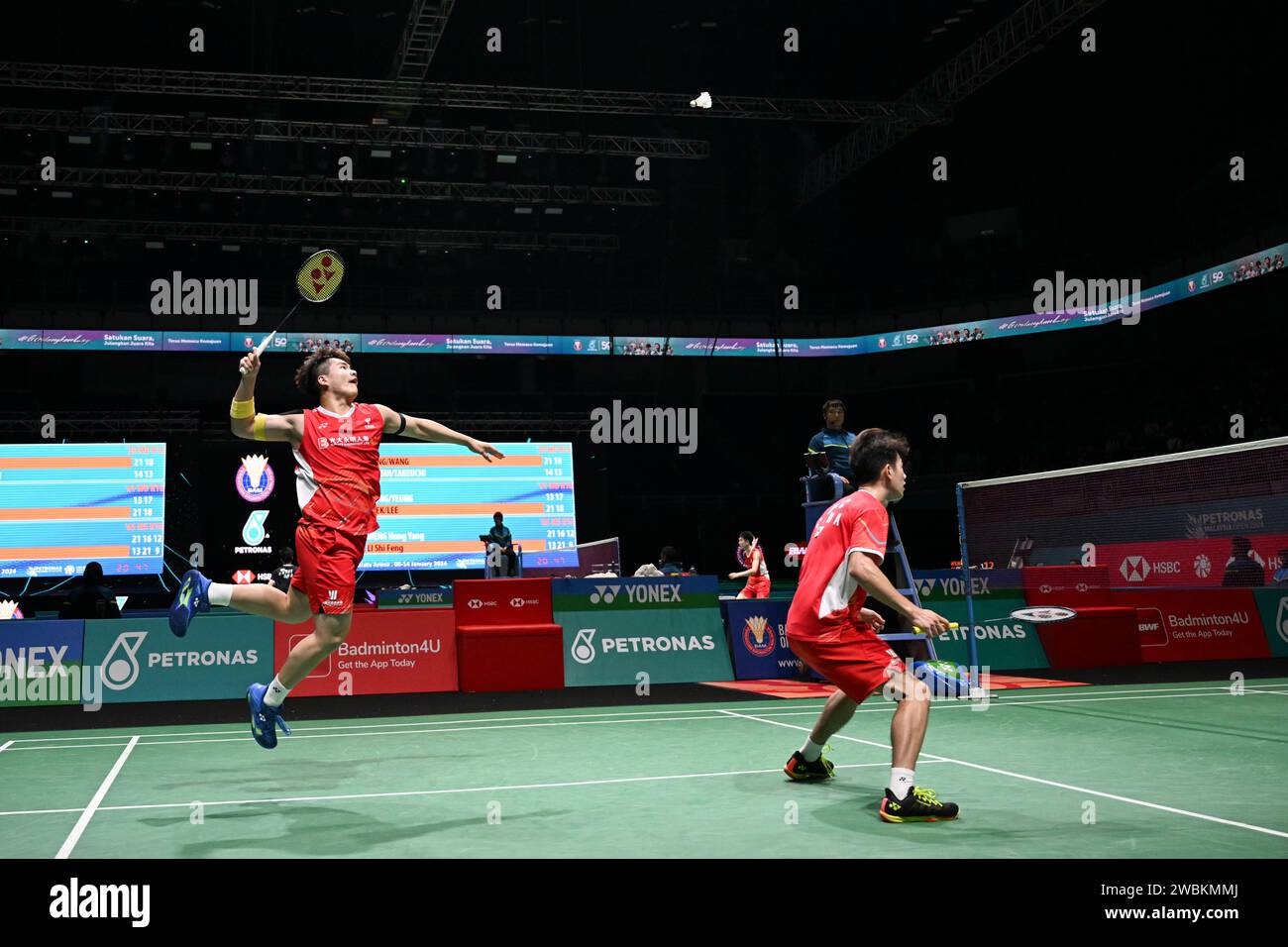 Kuala Lumpur, Malaysia. 11th Jan, 2024. Liang Weikeng(L)/Wang Chang of China compete during the ...