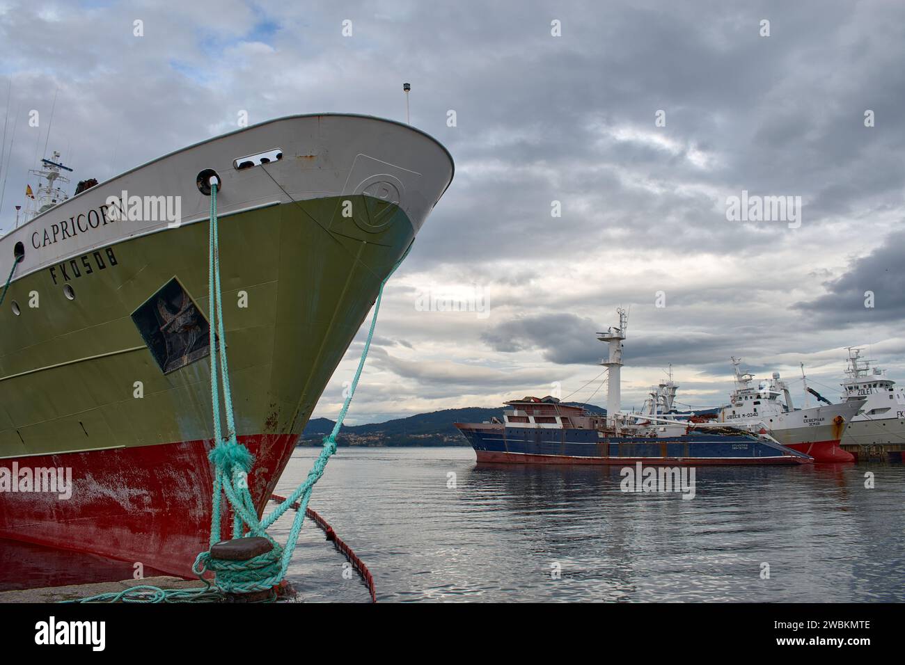 Deep-sea ships load provisions to go out to sea in the port of Vigo ...
