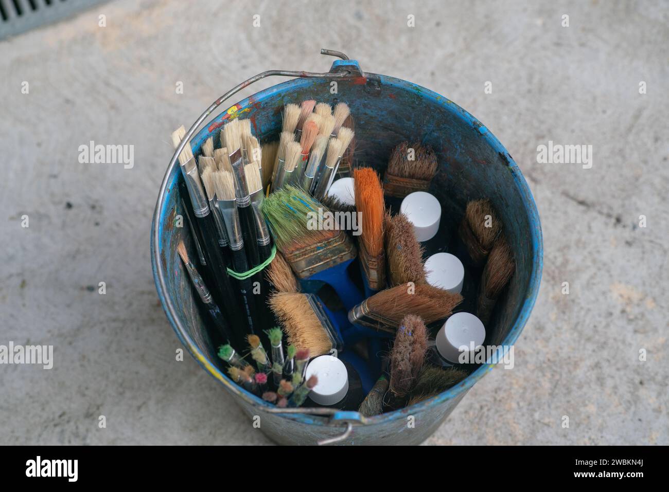 bucket full of brushes, for painting walls and canvases, paintings ...