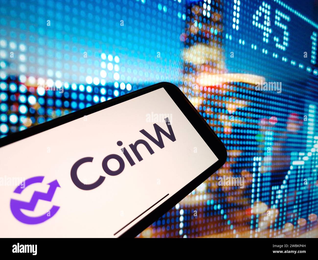 Konskie, Poland - January 05, 2024: CoinW cryptocurrency exchange logo displayed on smartphone ...