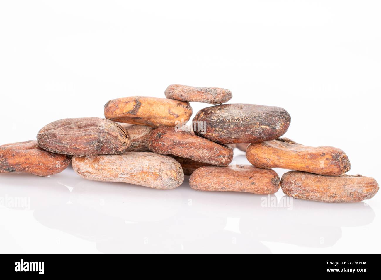 Several dry cocoa beans, macro, isolated on white background Stock ...