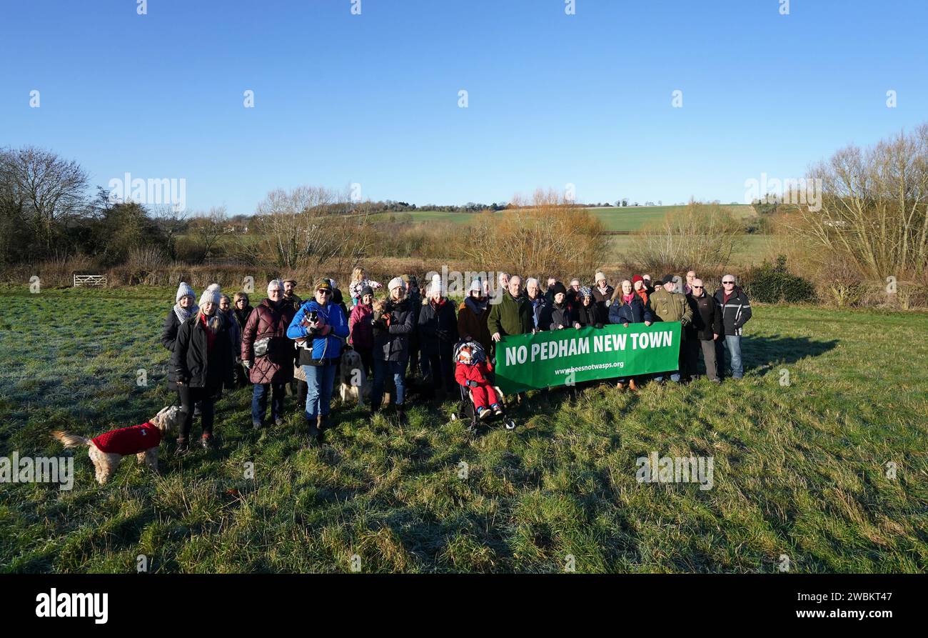 Members of the No Pedham New Town group stand beneath the site of a ...