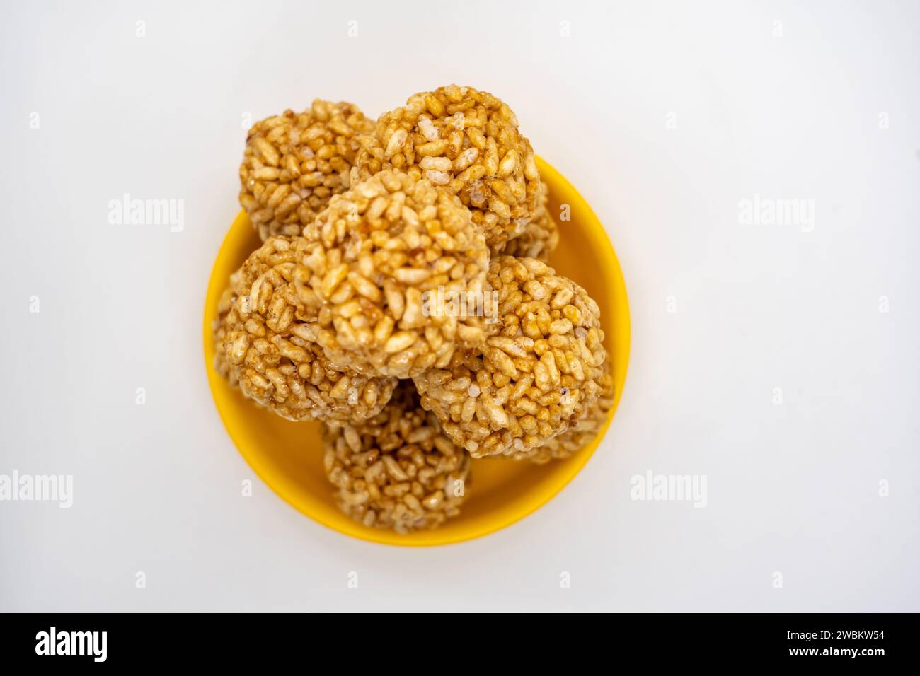 A plate of Murmura Murai Bhuja Ladoo Puffed Rice in Jaggery Balls for ...