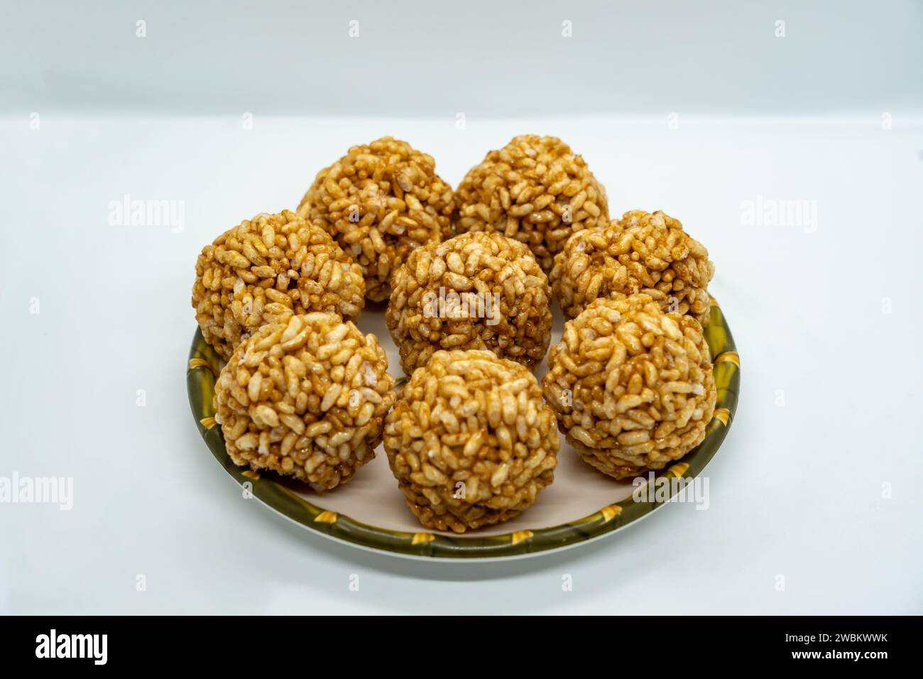 A plate of Murmura Murai Bhuja Ladoo Puffed Rice in Jaggery Balls for ...