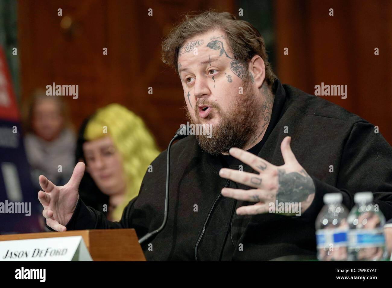 Musician Jason "Jelly Roll" DeFord testifies during a Senate Banking ...